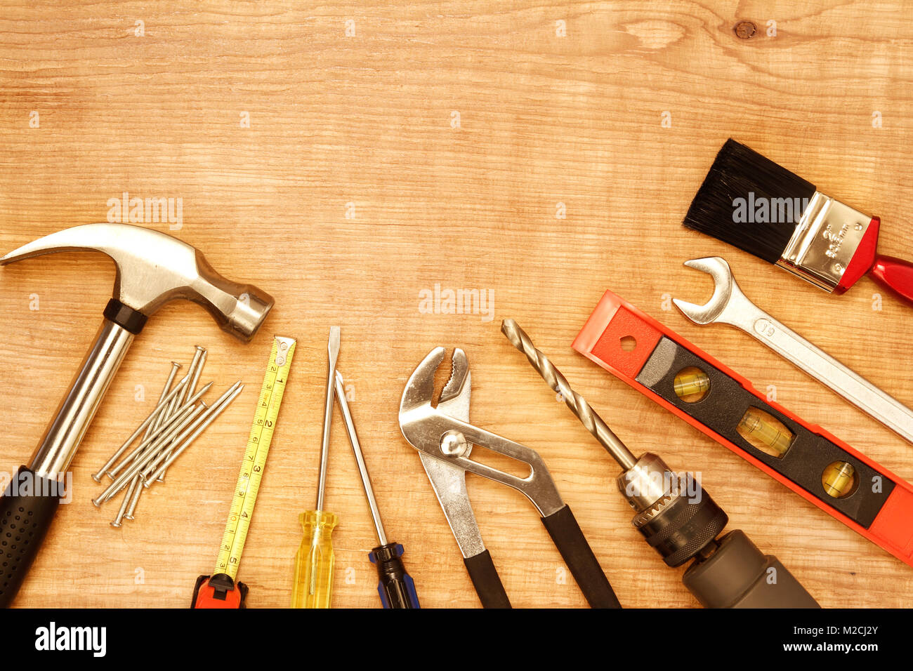 Assorted work tools on wood Stock Photo - Alamy
