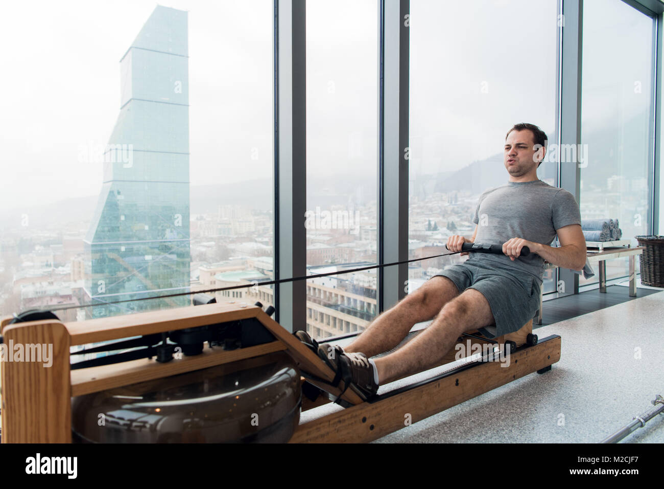 Male on rowing machine hi-res stock photography and images - Alamy