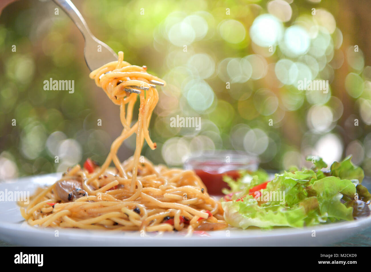Italian spaghetti with chicken on white plate Stock Photo - Alamy