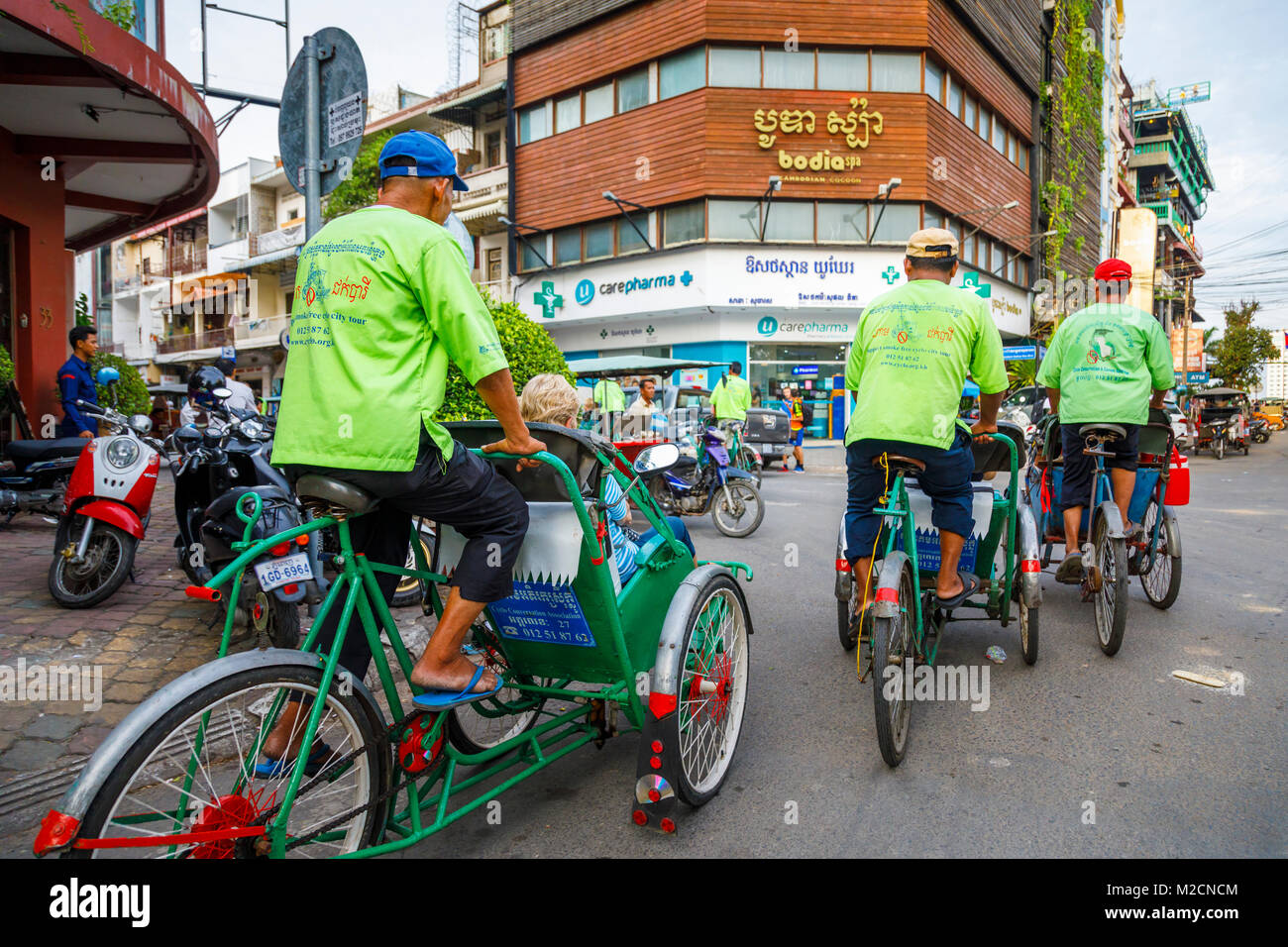 Local cycle rickshaws on a tourist rickshaw city tour excursion in ...