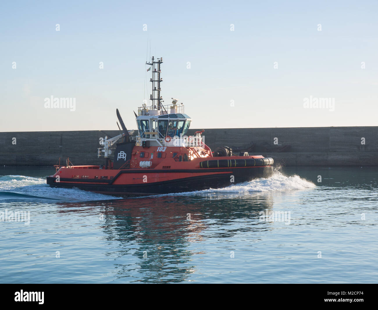 Genoa Italy December 23, 2017: Powerful Tugboat moving fast next to ...
