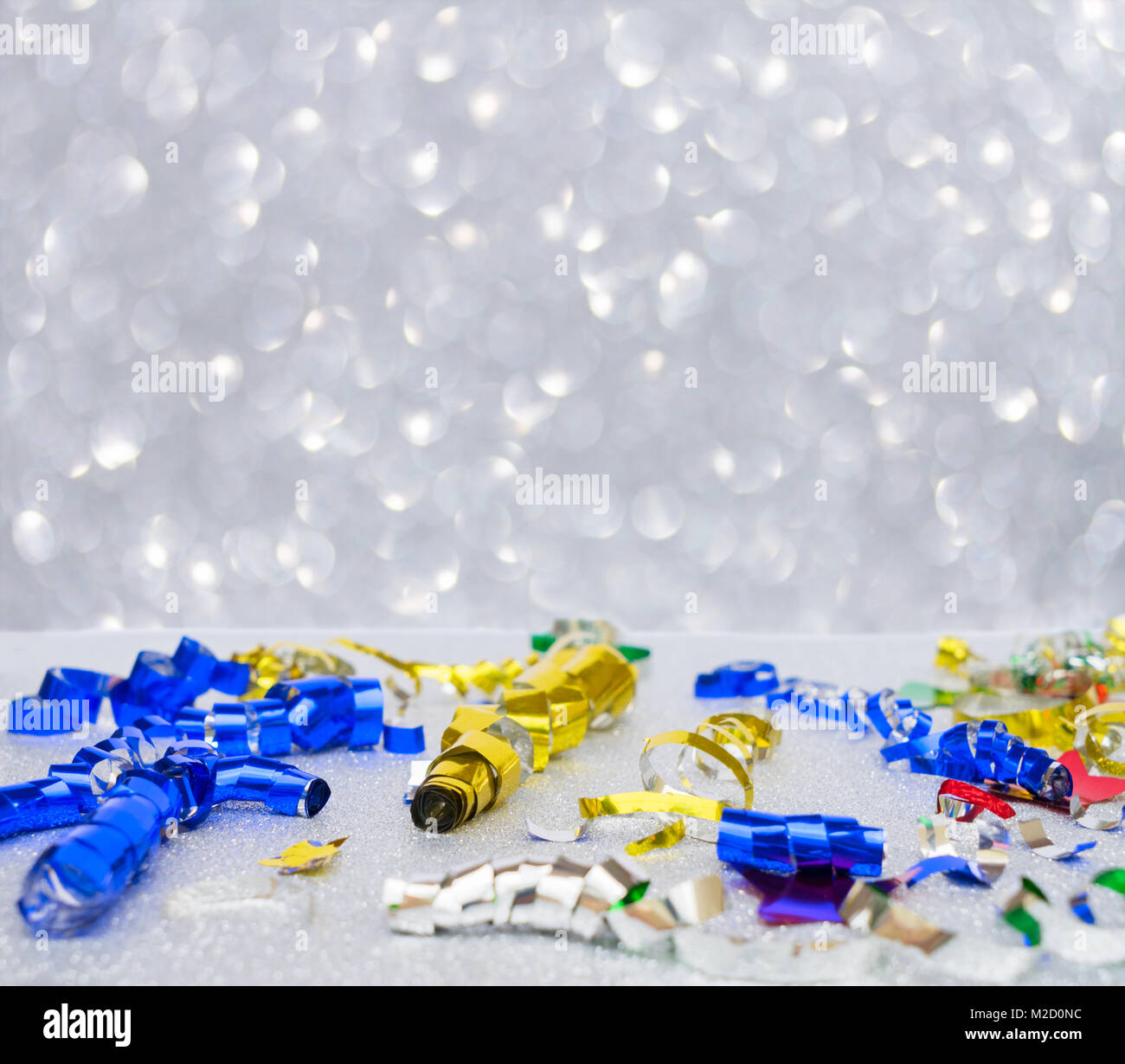 Carnaval festive curling paper and confetti decorations on silver ...