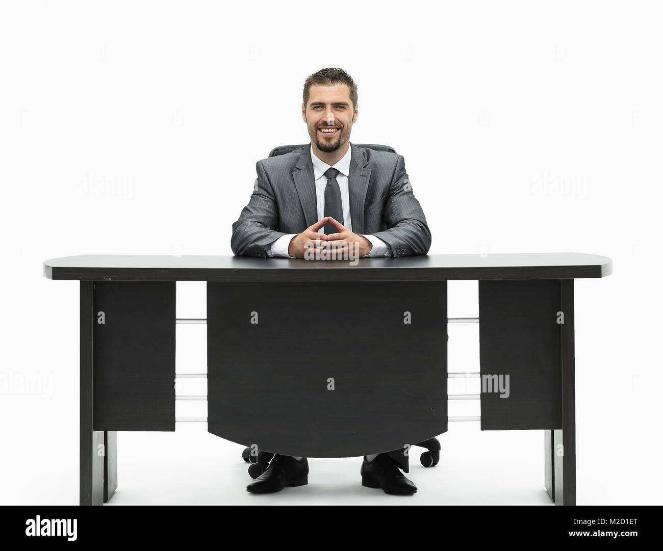 Boss sitting behind desk standing hi-res stock photography and images ...