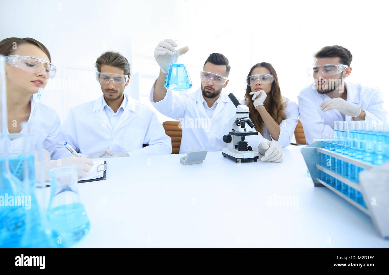 Team of scientists working together at the laboratory Stock Photo - Alamy