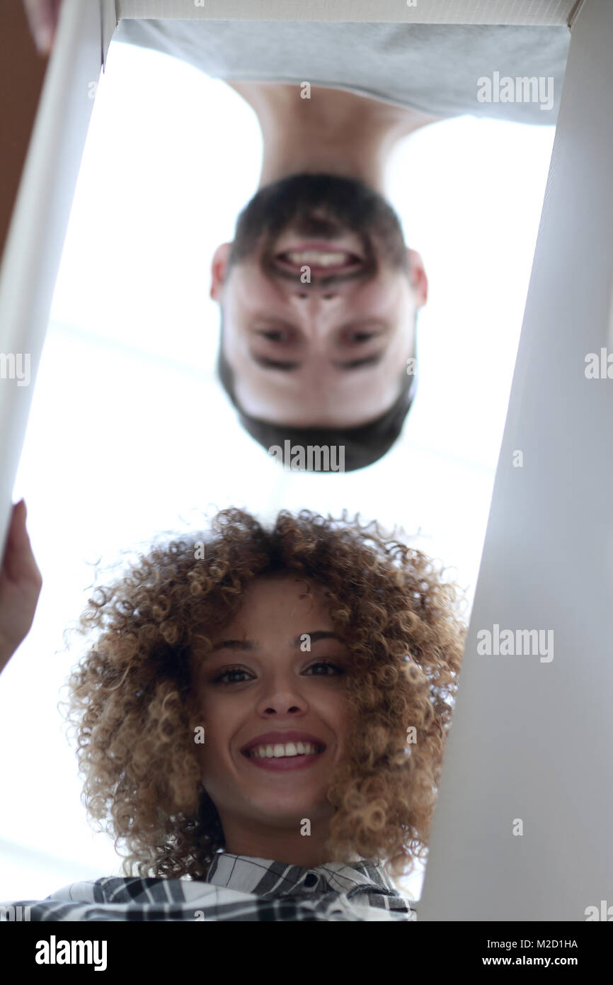 Close-up view of husband and wife looking inside the box Stock Photo ...
