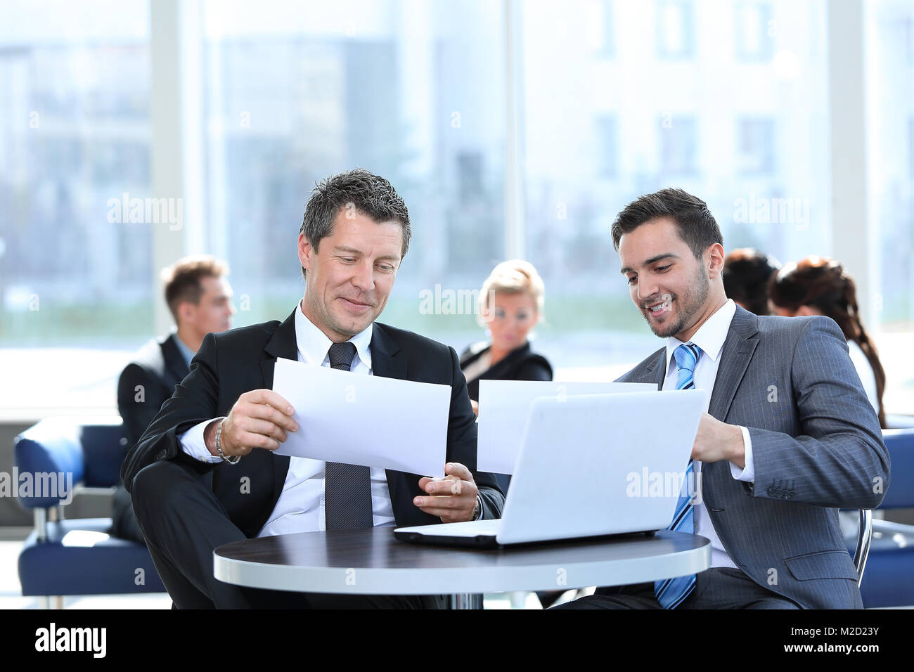 Two men business partners reading hi-res stock photography and images ...