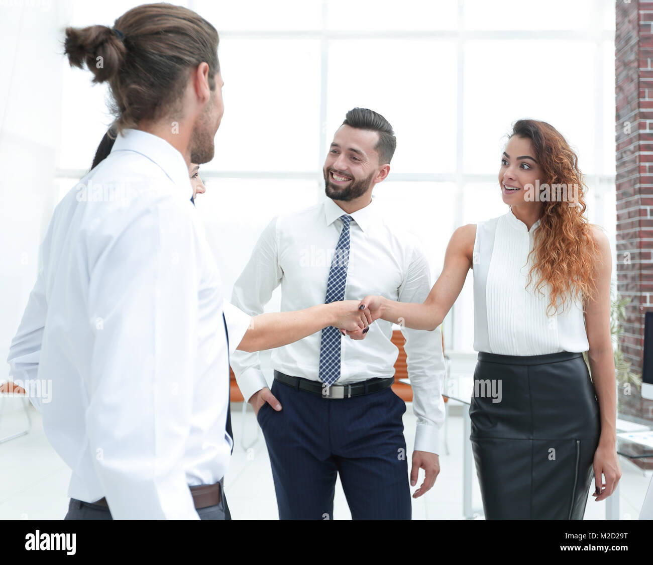 business women greet each other with a handshake Stock Photo - Alamy