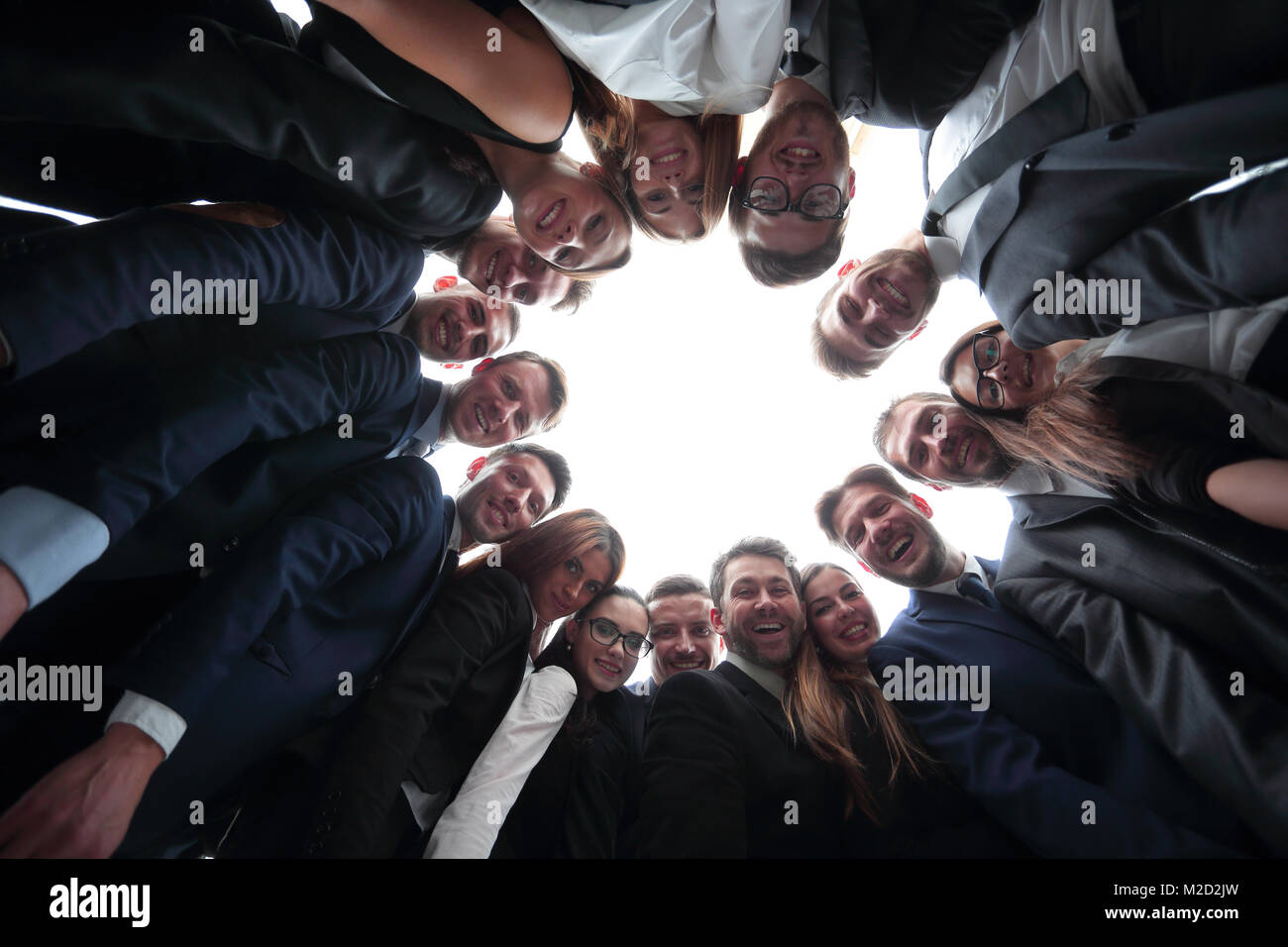 large business team is forming a circle and looking at the camera Stock ...