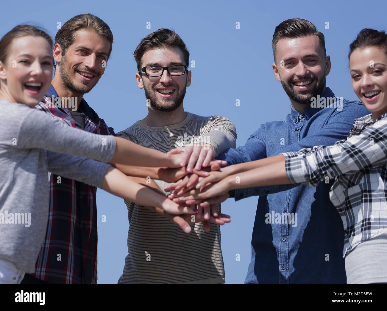 team of young people shows their unity Stock Photo - Alamy