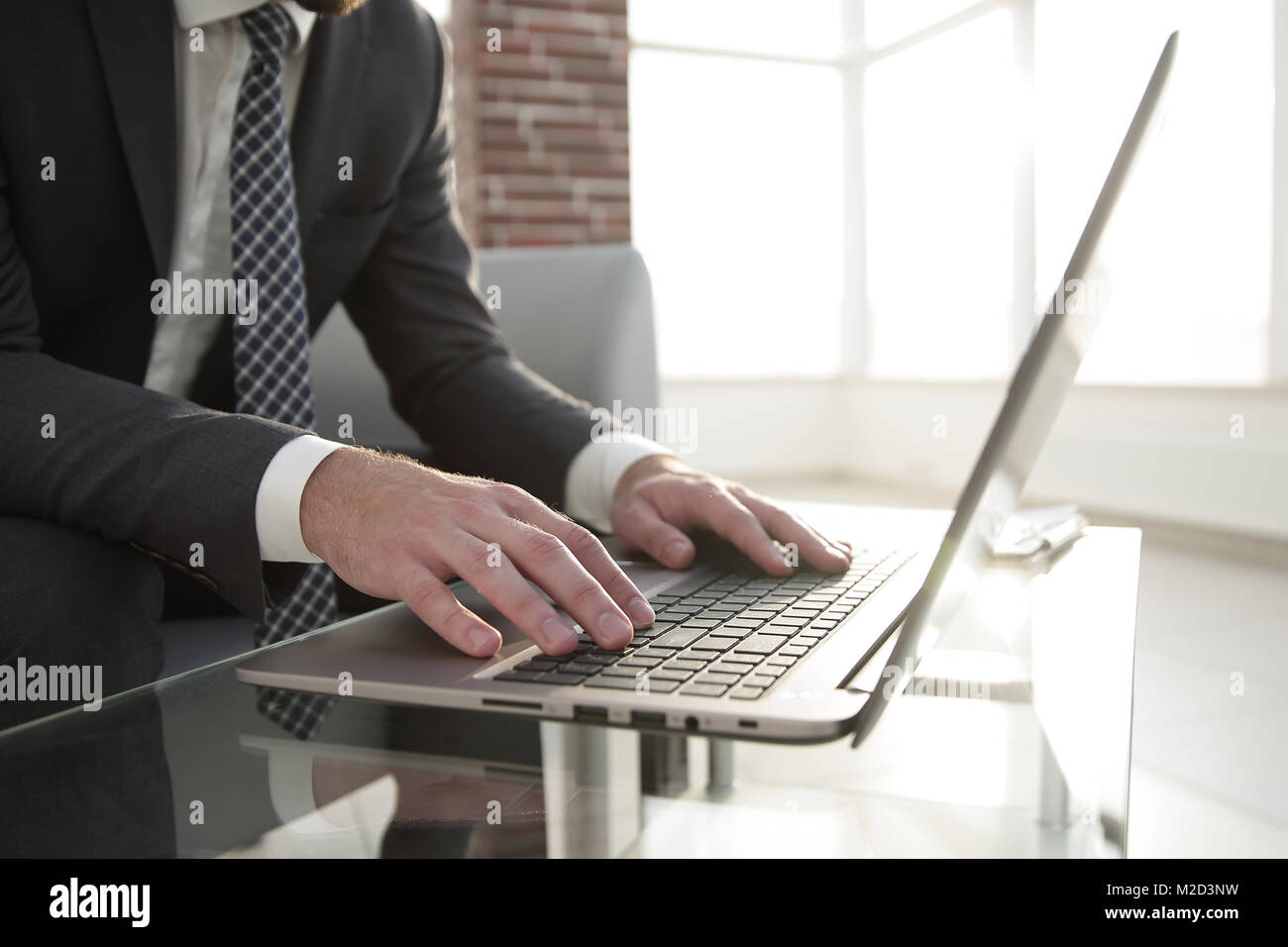 Portrait of successful businessman working in modern office Stock Photo ...