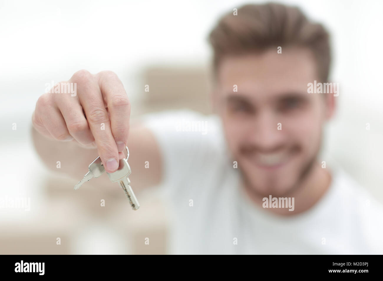 closeup.man showing keys of new apartments Stock Photo - Alamy
