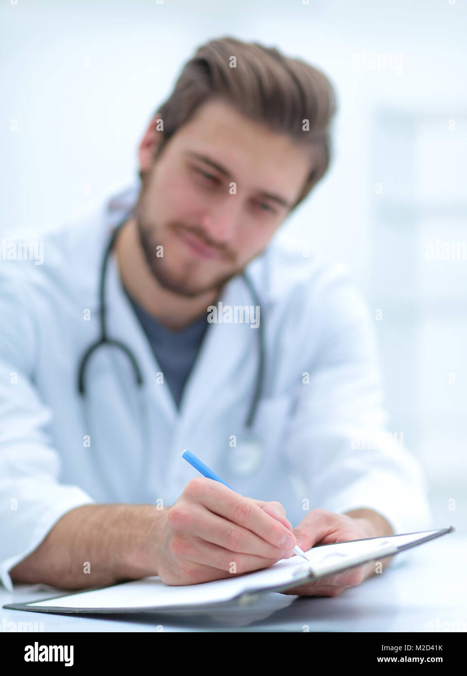 background image of a doctor writing out a prescription Stock Photo - Alamy