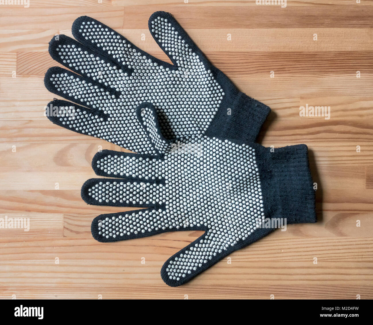 Navy blue woolen gloves with pebbled rubber palms for a better grip ...