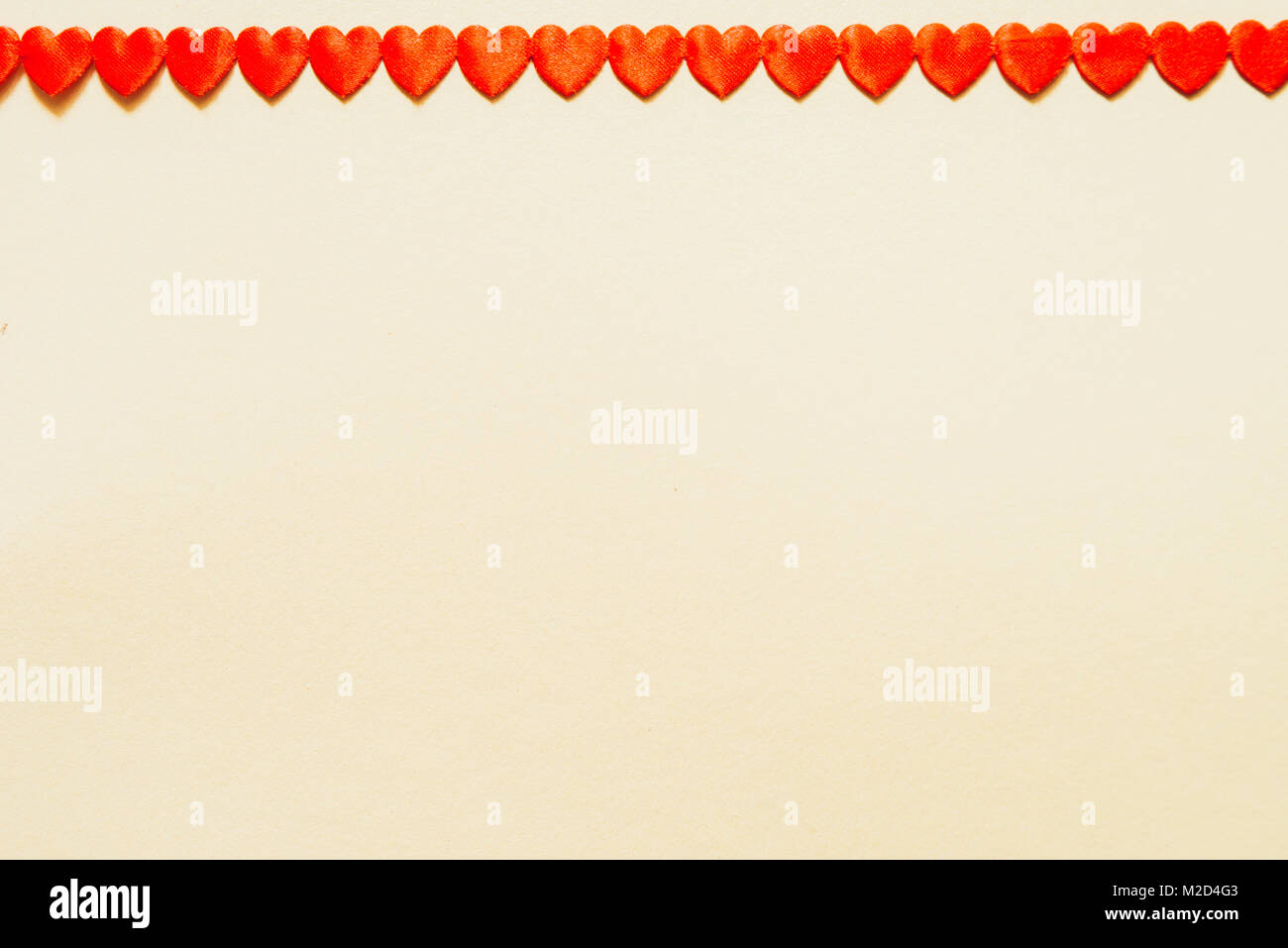 Heart shaped ribbon borders a yellow background, valentine's day theme ...