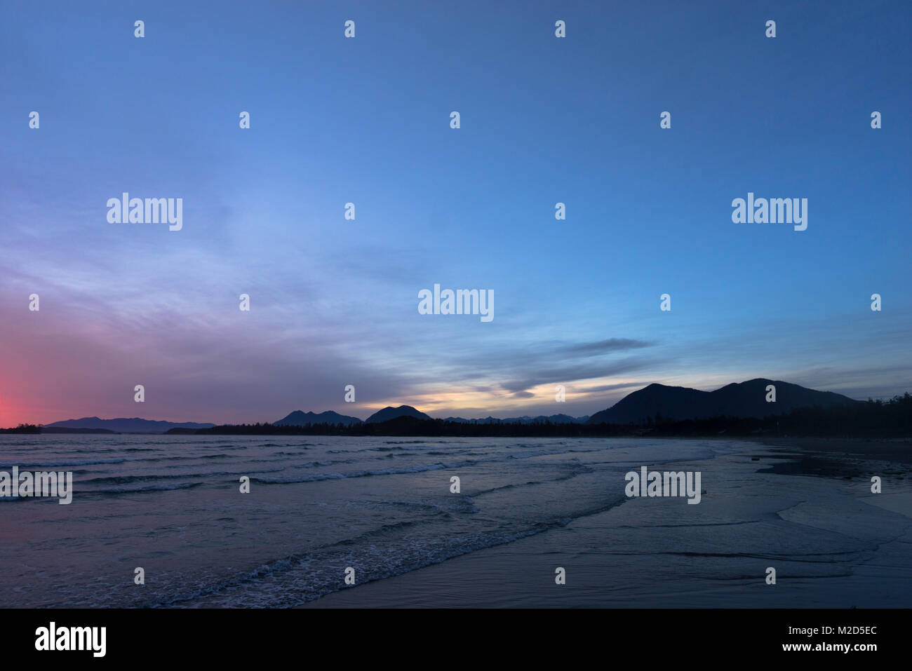 View of the sunset and the ocean from the beach Tofino, British ...