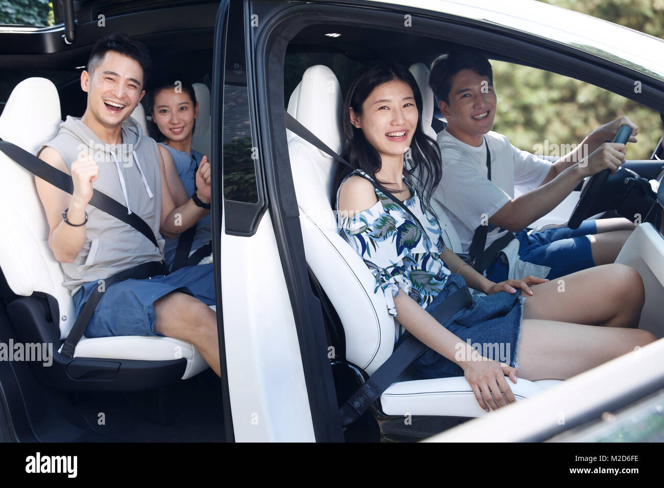 Young people are driving by car Stock Photo - Alamy