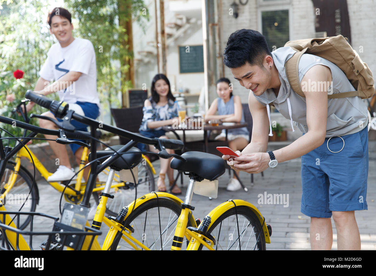 Young people ride bicycles Stock Photo - Alamy