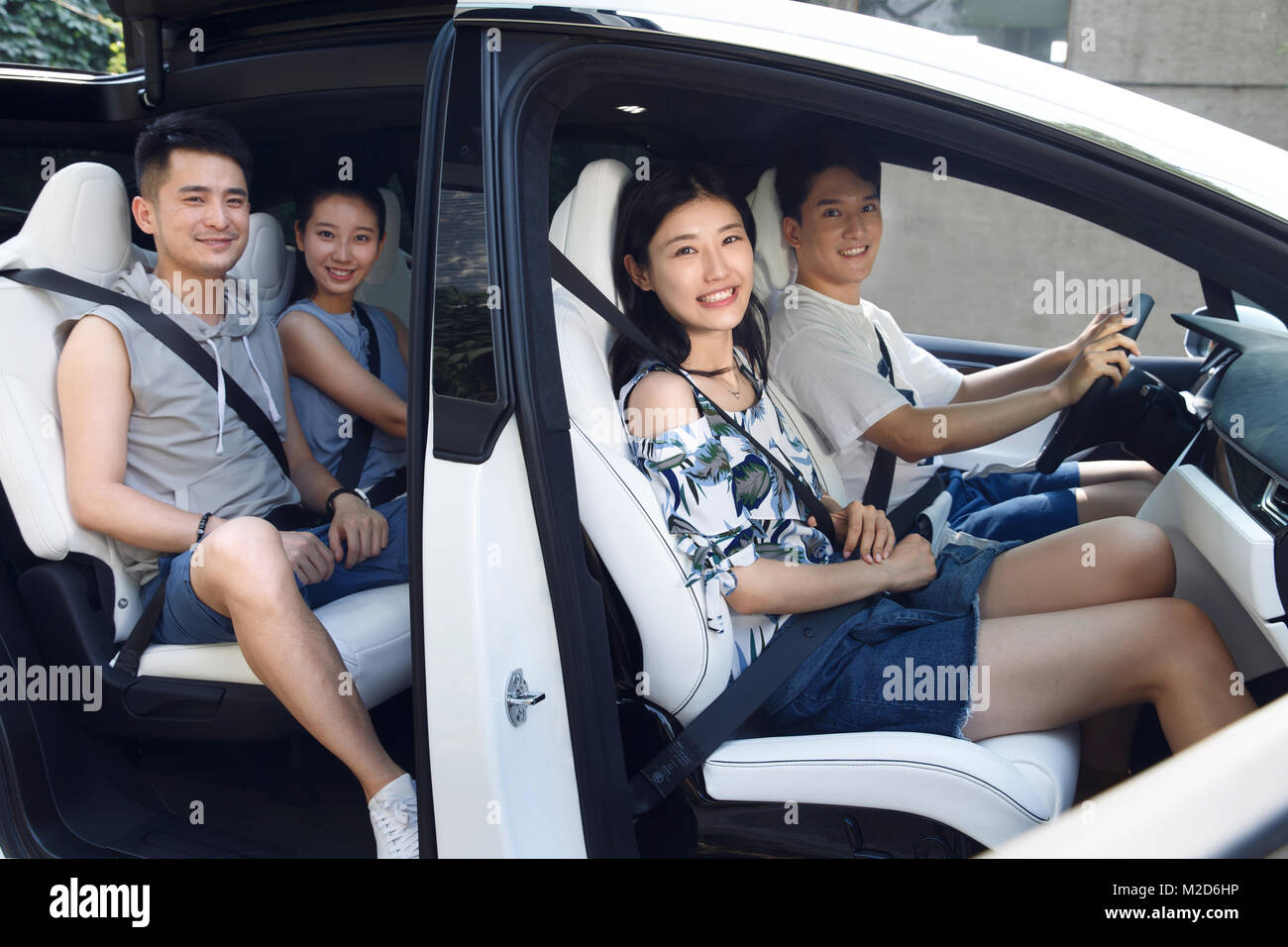 Young people are driving by car Stock Photo - Alamy