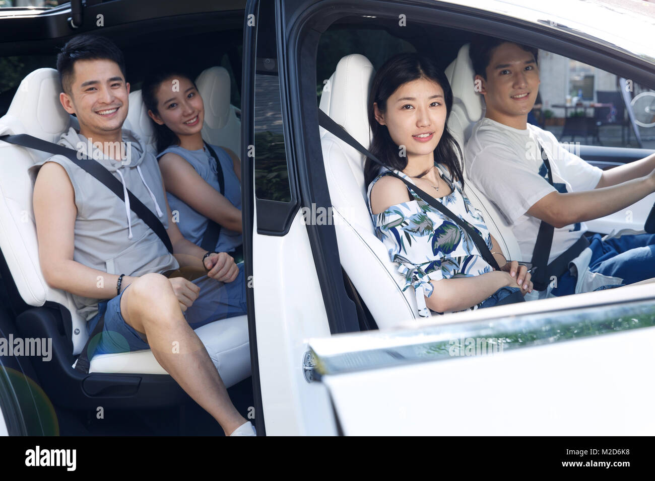 Young people are driving by car Stock Photo - Alamy