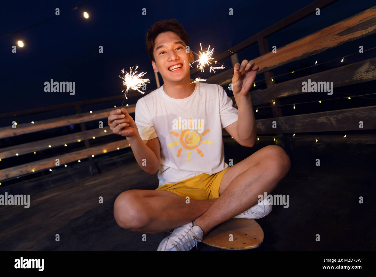 Young men set off fireworks Stock Photo - Alamy