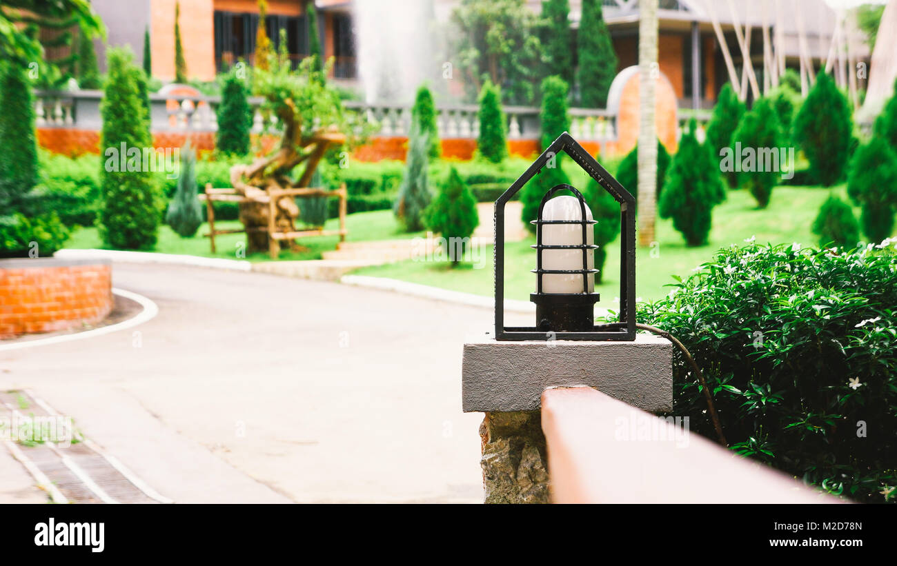Lamp post on Cement fence Stock Photo - Alamy