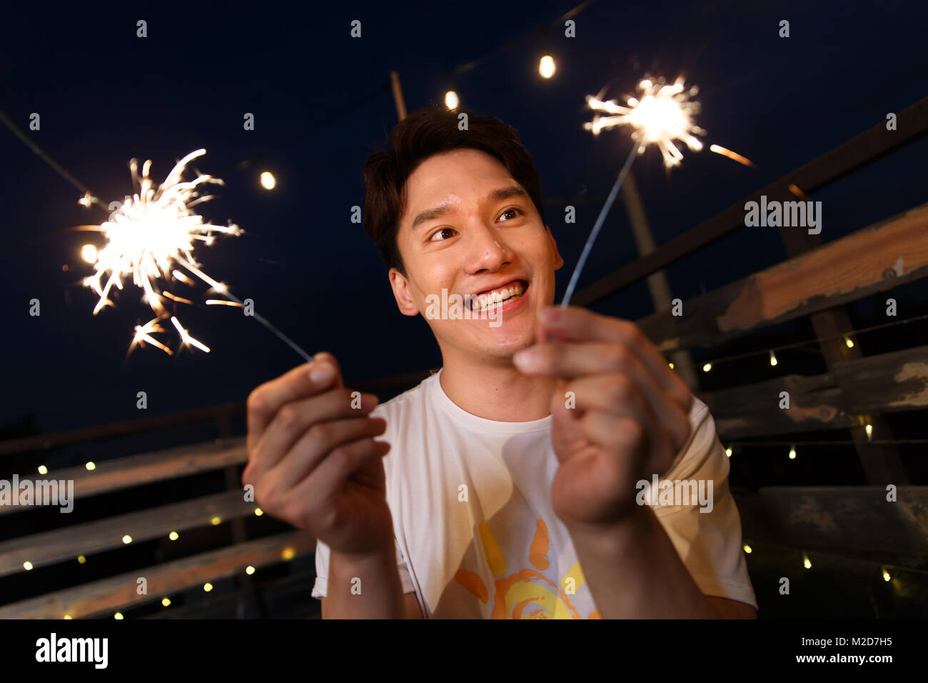 Young men set off fireworks Stock Photo - Alamy
