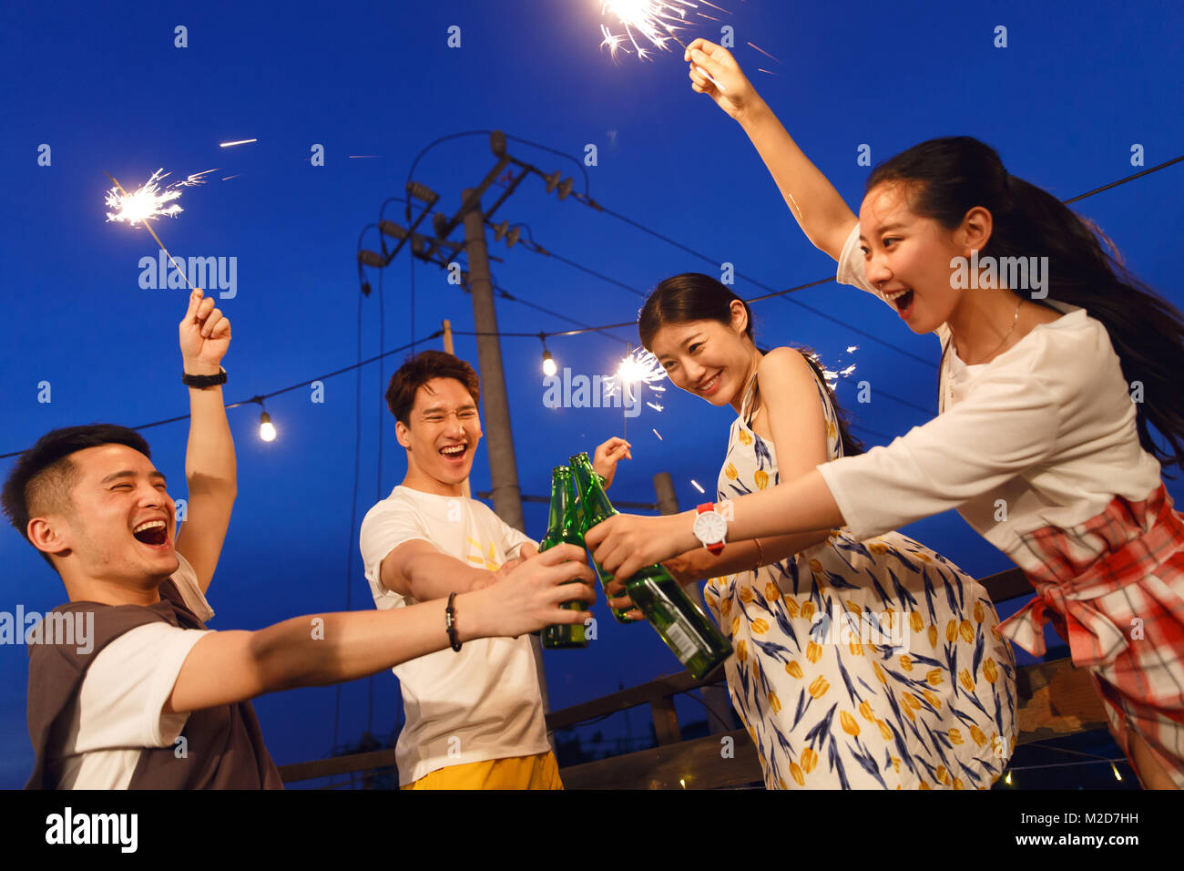Young people gather, drink, and set off fireworks Stock Photo - Alamy