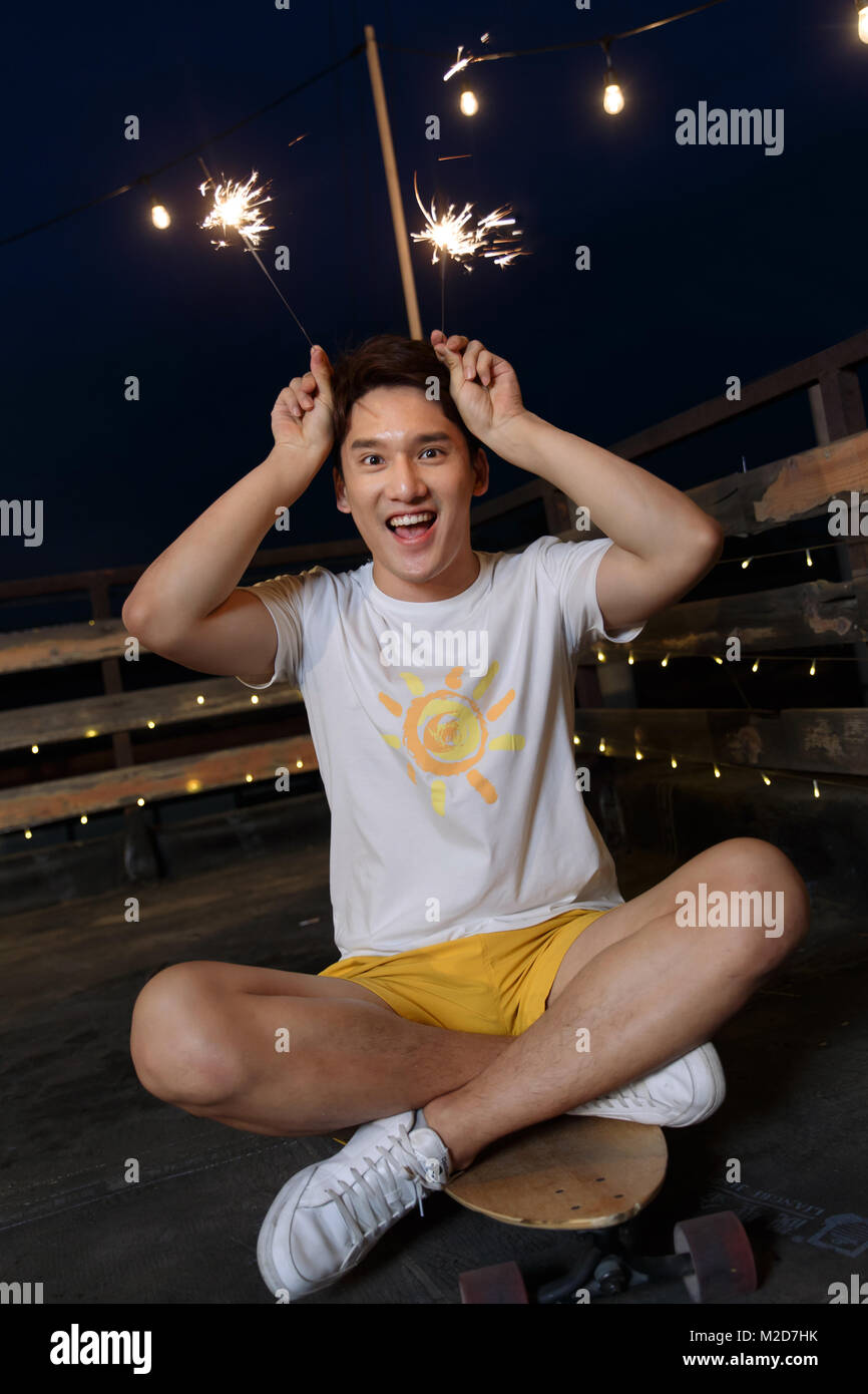 Young men set off fireworks Stock Photo - Alamy