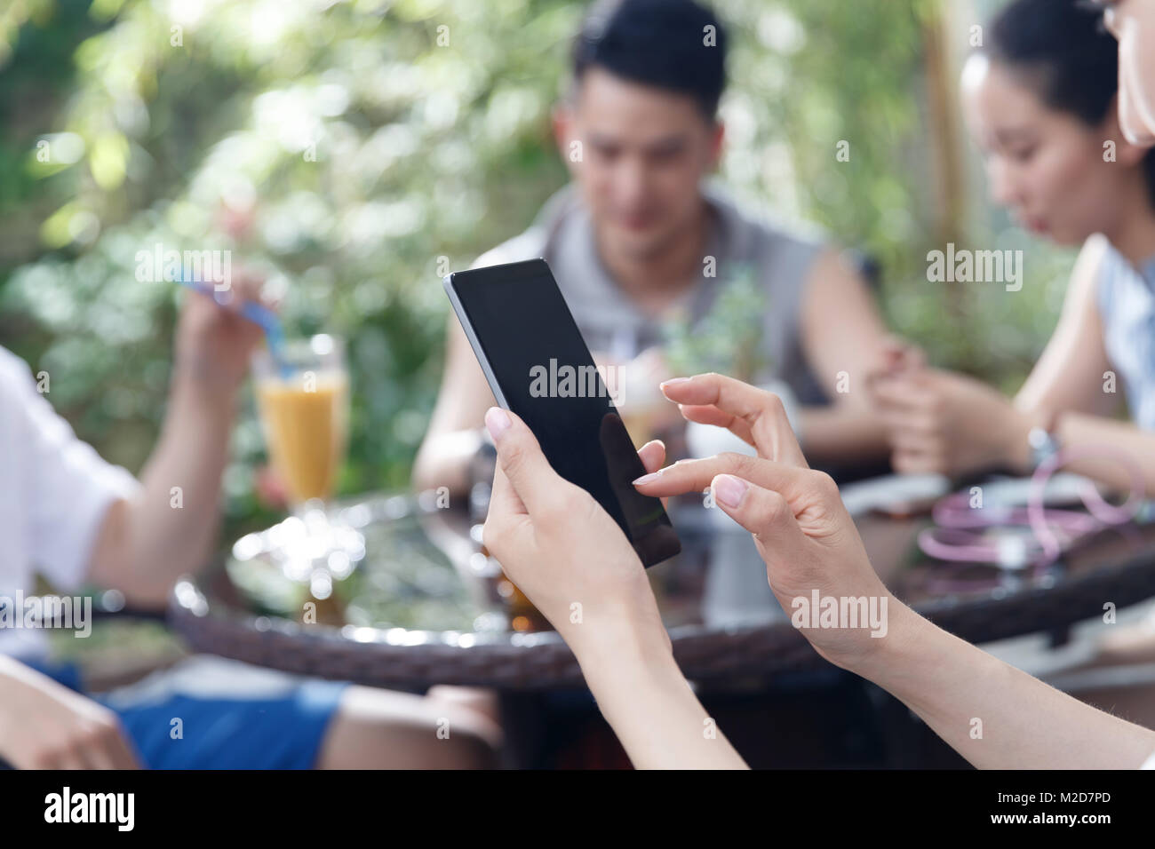 Young people watch mobile phones Stock Photo - Alamy