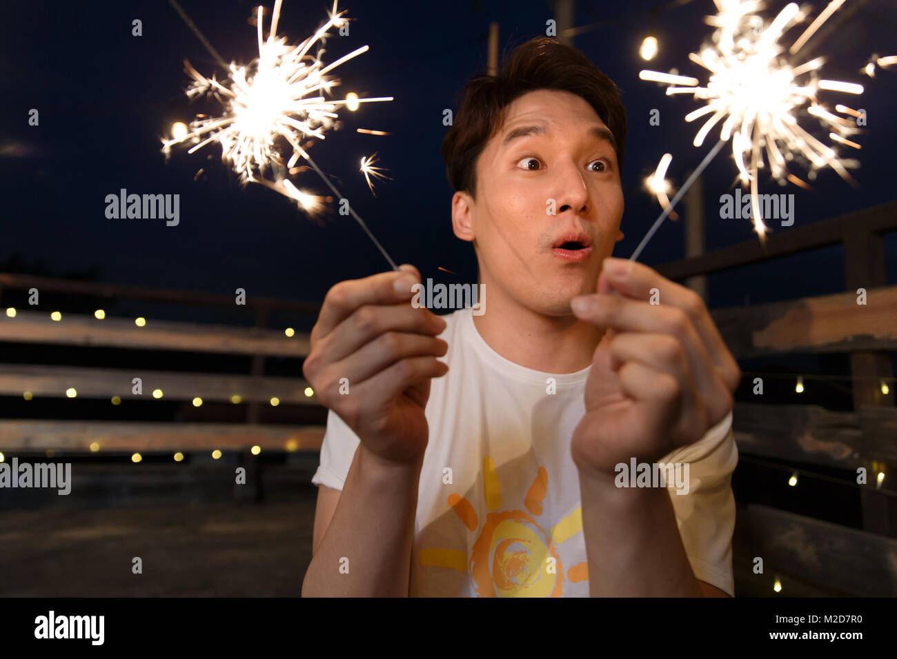 Young men set off fireworks Stock Photo - Alamy