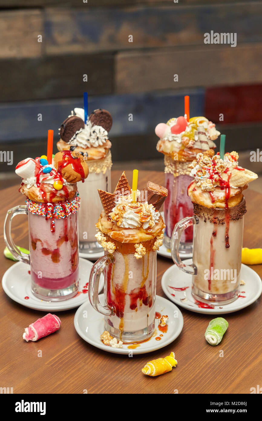 Group of caramel marshmallow candy milk shake cocktails with whipped ...