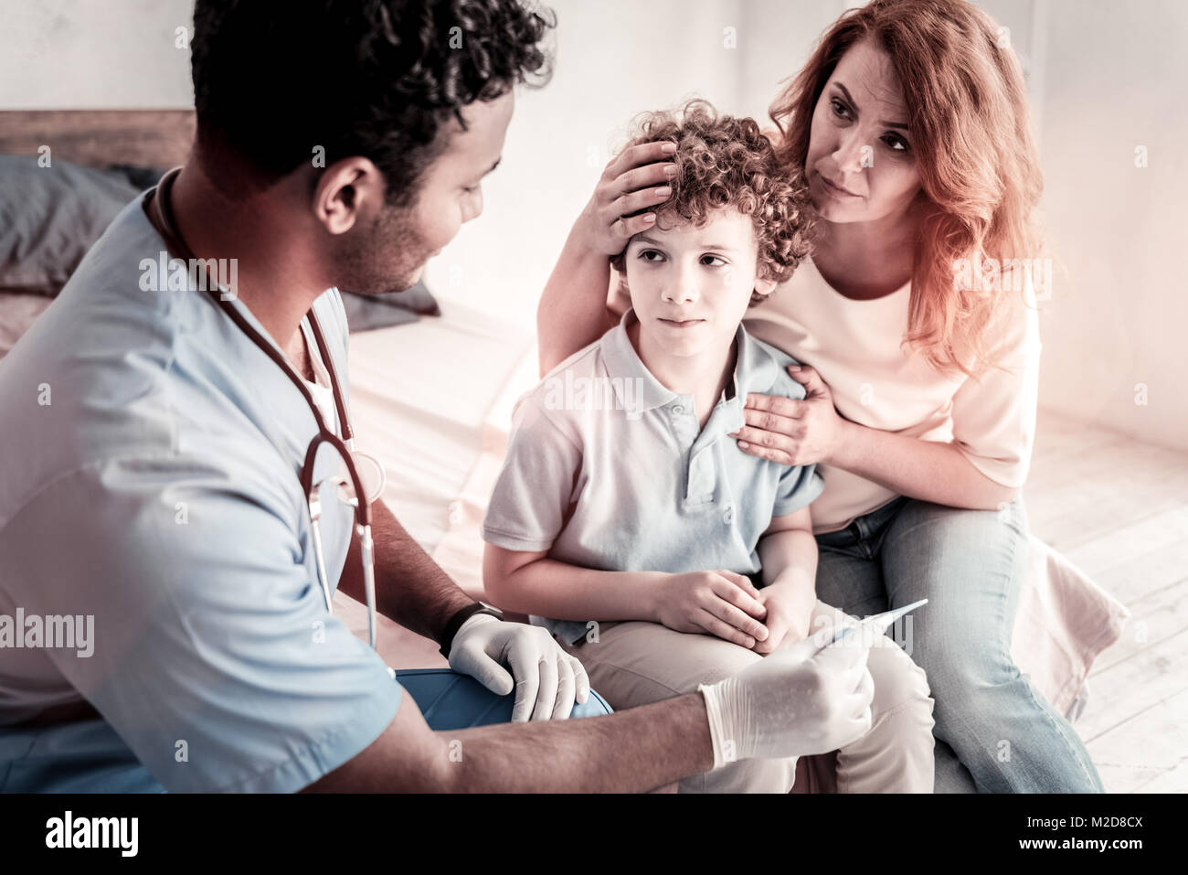 Scared mother listening to doctor making diagnosis Stock Photo - Alamy