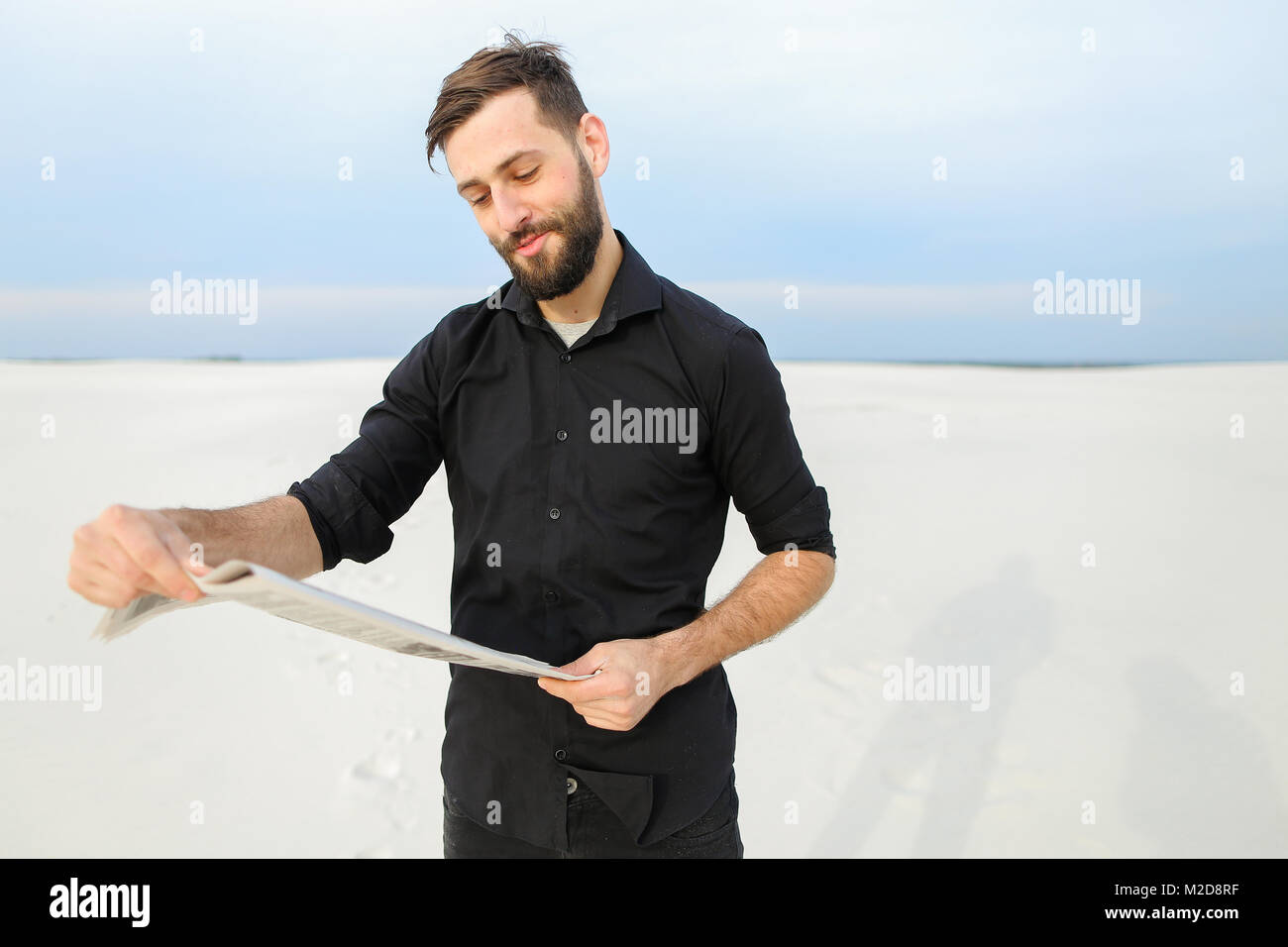 doctor reading newspaper in countryside Stock Photo - Alamy