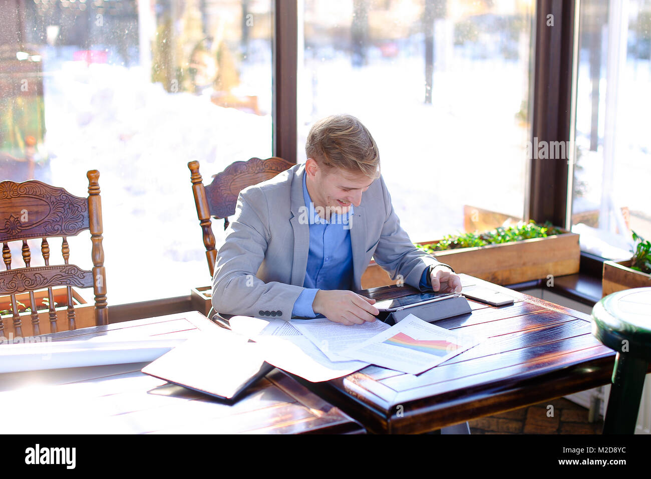 Young student preparing before exam in fast motion at cafe with Stock ...