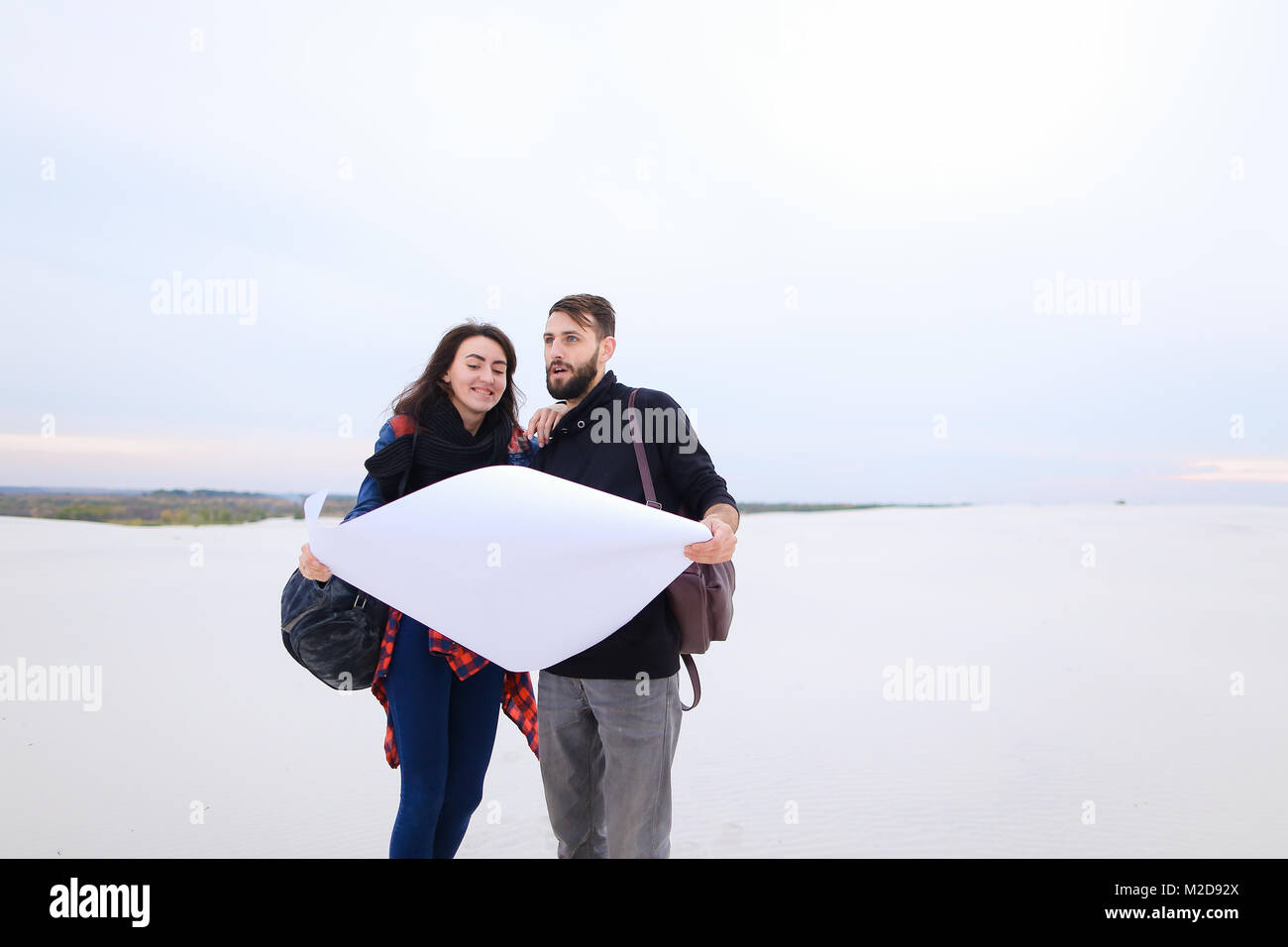 Presenters of travel program married couple viewing map Stock Photo - Alamy
