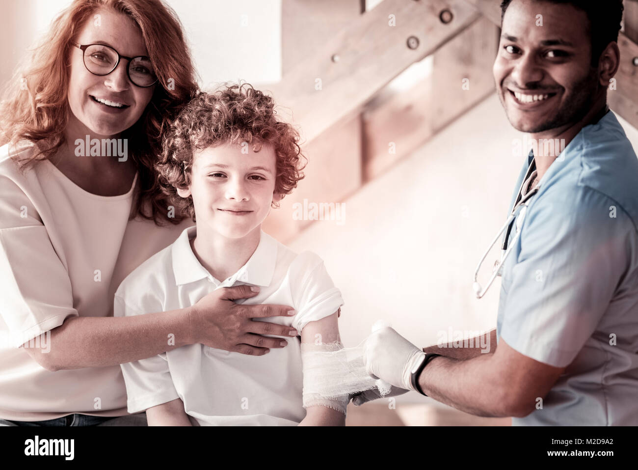 Satisfied medical worker and patients smiling cheerfully Stock Photo ...
