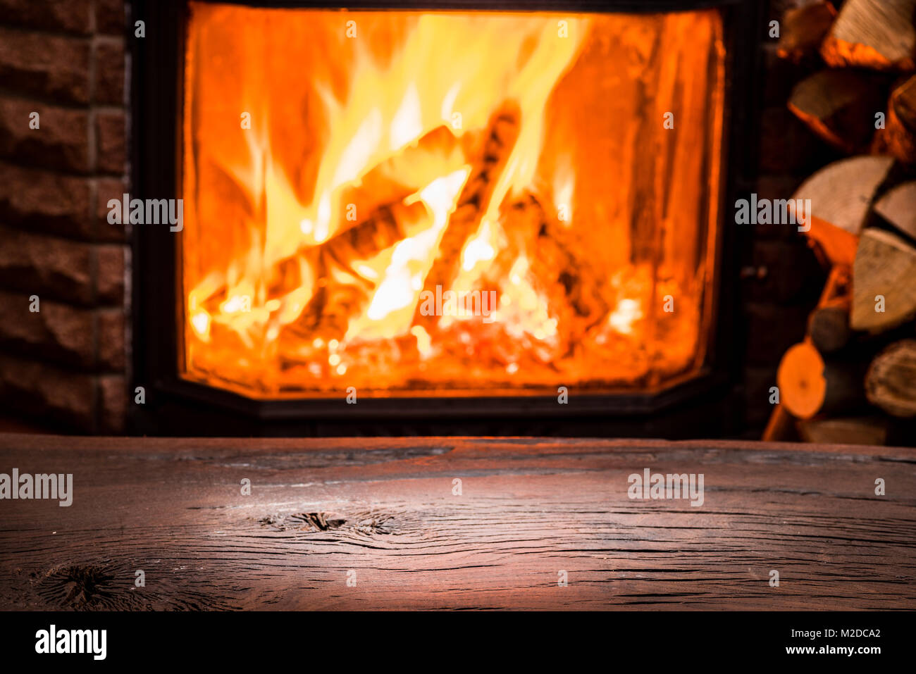 Defocused warm fireplace burning in hi-res stock photography and images ...