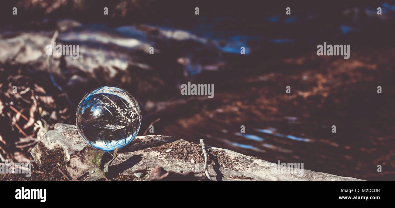 Crystal ball on the stone Stock Photo - Alamy