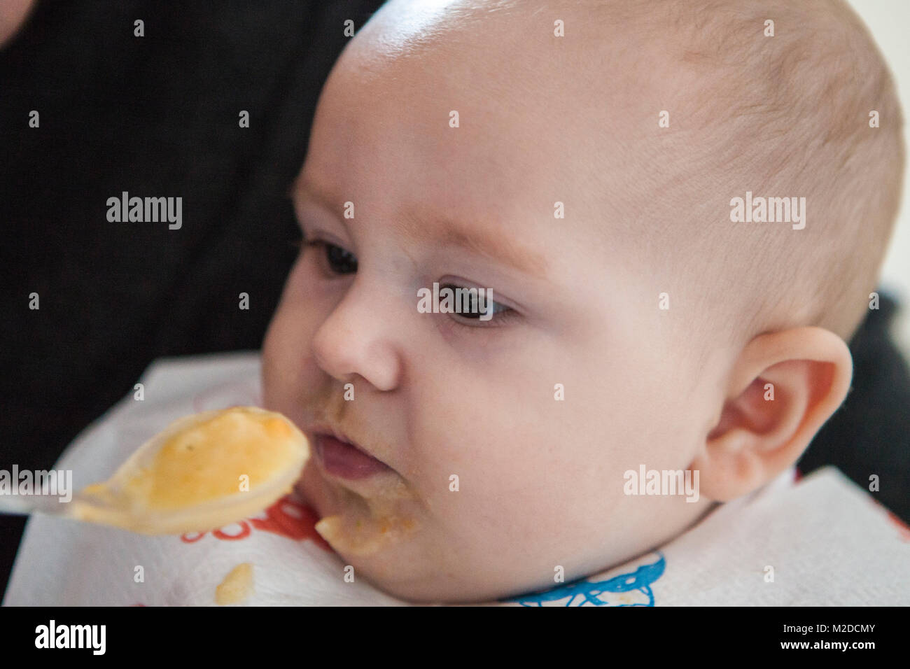 baby six months while eating pasta Stock Photo - Alamy