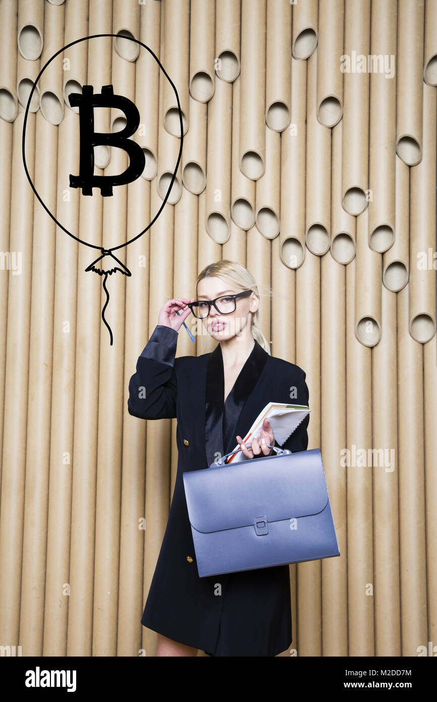 Beautiful blond woman showing standing near bitcoin sketch. Virtual ...