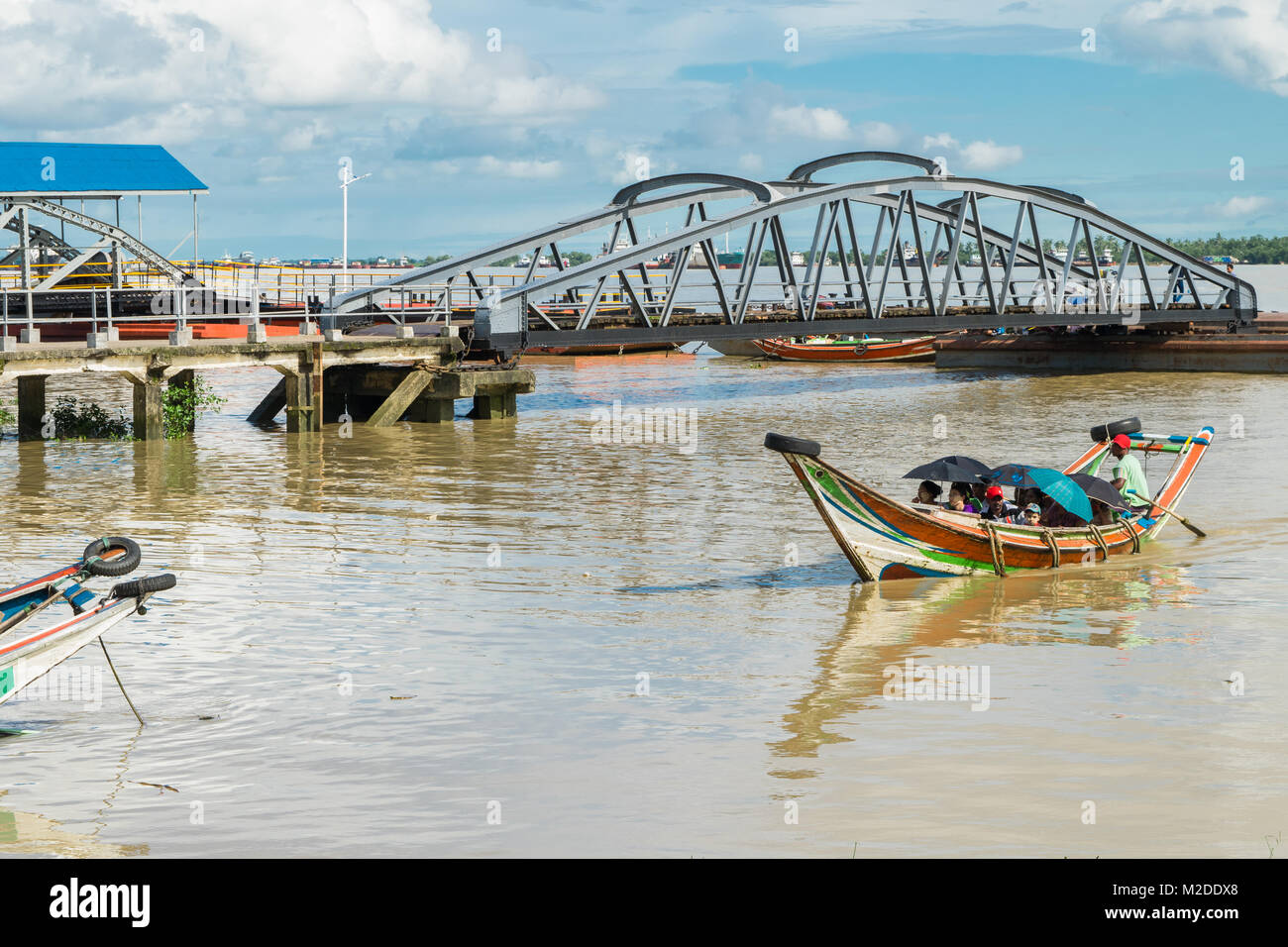 A boat arriving at Botahtaung jetty, carrying Burmese passengers on the ...