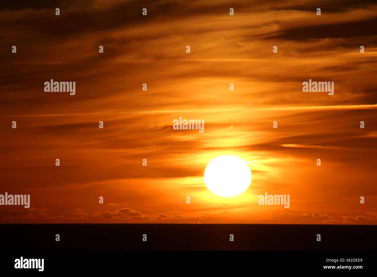 Beautiful sunset looks on fire Stock Photo - Alamy