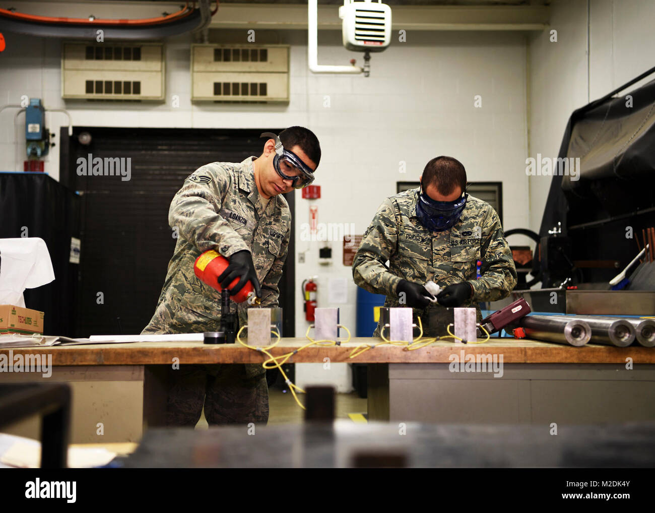 (From left) Senior Airman Brianjonathan Loanzon, 5th Maintenance ...