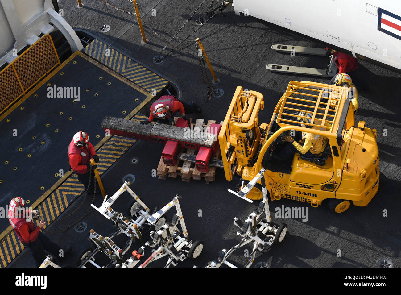 ARABIAN GULF (Jan. 2, 2018) Sailors load a forklift on the flight deck ...