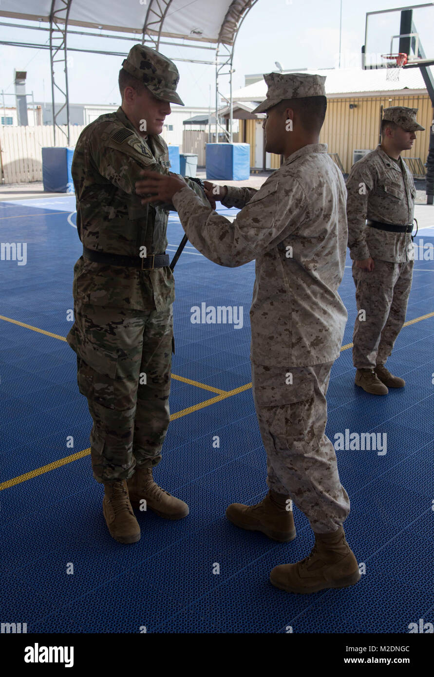 U.S. Marine Corps Sgt. Raymundo Rodriguez shows U.S. Army Cpl. Shawn ...