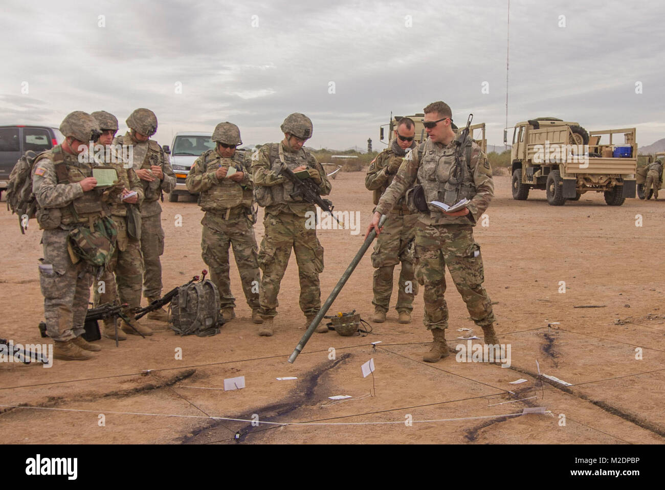 A platoon leader with 1st Battalion, 158th Infantry Regiment gives an ...