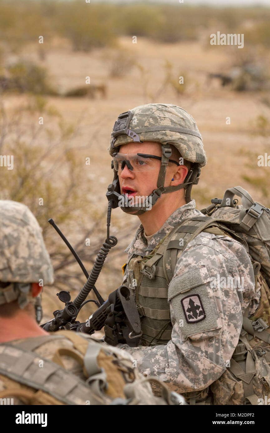 A platoon leader with 1st Battalion, 158th Infantry Regiment calls in a ...