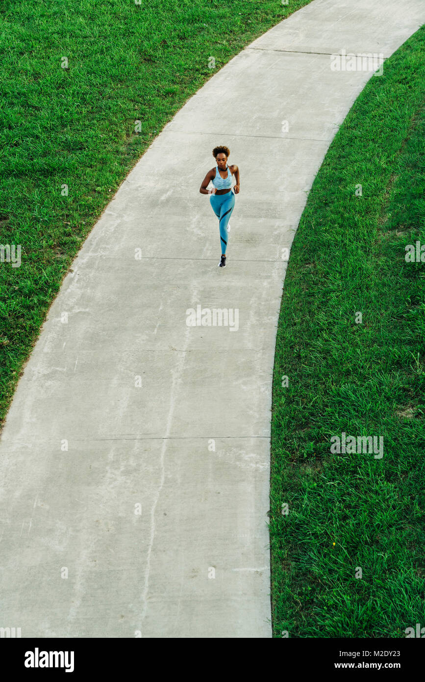 Female running on long grass hi-res stock photography and images - Alamy