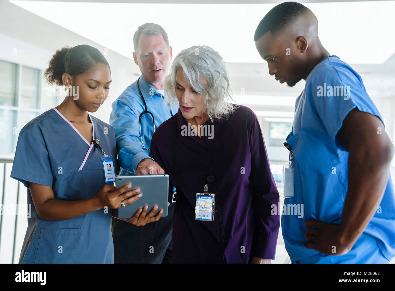 Doctors and nurses using digital tablet Stock Photo - Alamy
