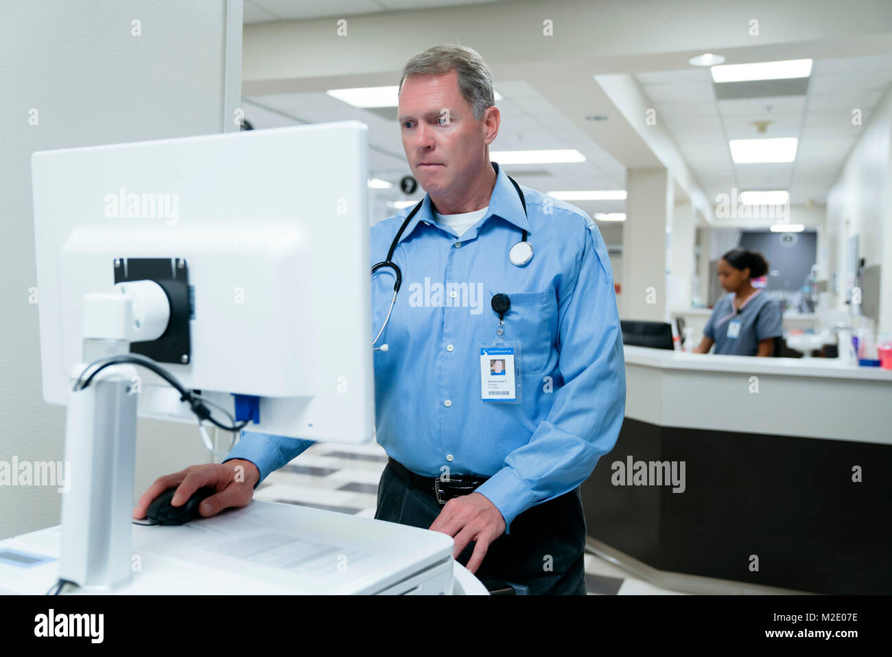 Doctor using computer in hospital Stock Photo - Alamy